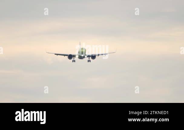 Jet plane approaching landing. Aircraft descending. Slow motion ...