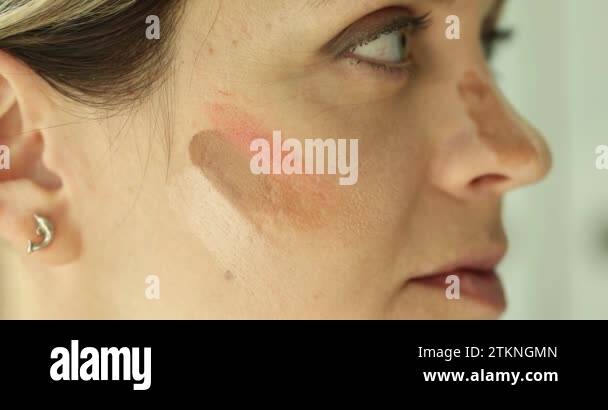 Woman with different shades of foundation on your face. Choice of ...