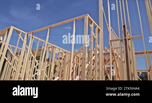 House with wooden framework frame is being constructed with support ...