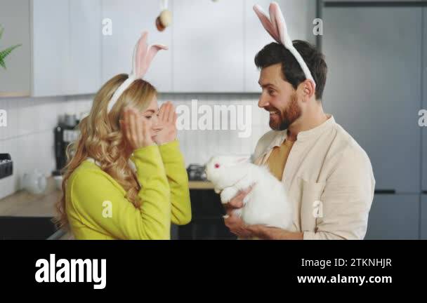 Handsome husband doing a surprise for his cute wife. Man gifting a ...