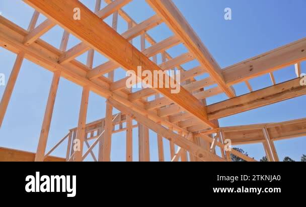 House with wooden framework frame is being constructed with support ...