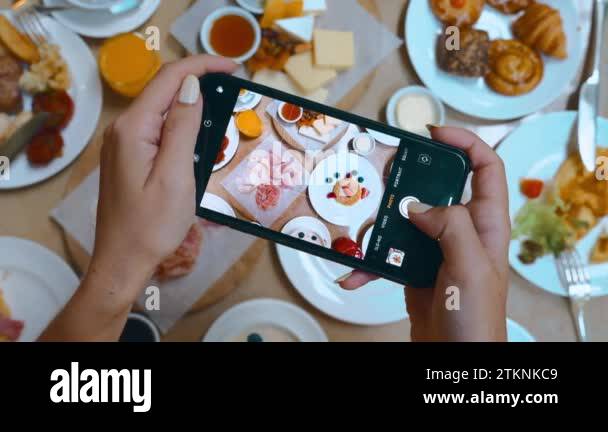 Woman influencer and a blogger, records her restaurant breakfast ...