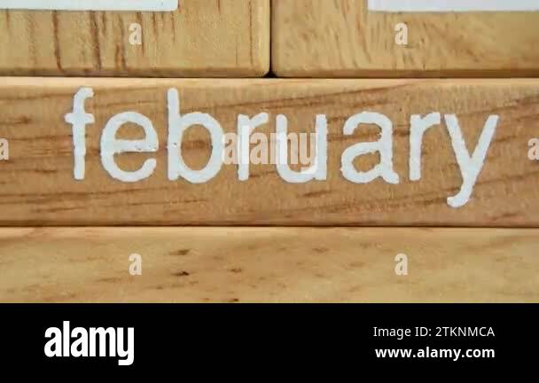 The wood calendar changing the month from January to December Stock ...