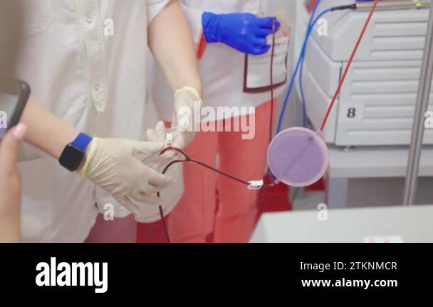 Instructor shows automated cell blood processor and distillation system ...