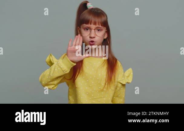 Stop gesture. Angry young preteen child girl kid say No hold palm ...
