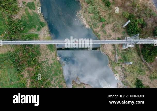 Aerial footage of the suspension bridge which can only be used by two ...