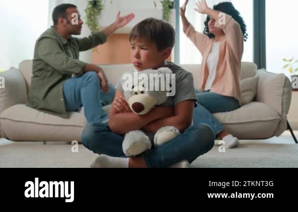 Upset Caucasian little boy preschool son hug teddy toy while African ...