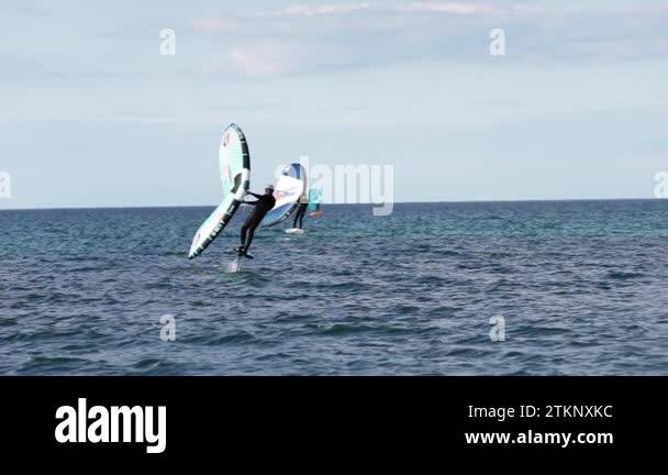 Modern water sport. Hydrofoil ride on the ocean using the wing and the ...