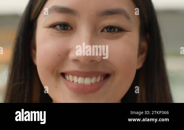 Close up female Asian face ethnic happy young girl chinese korean ...