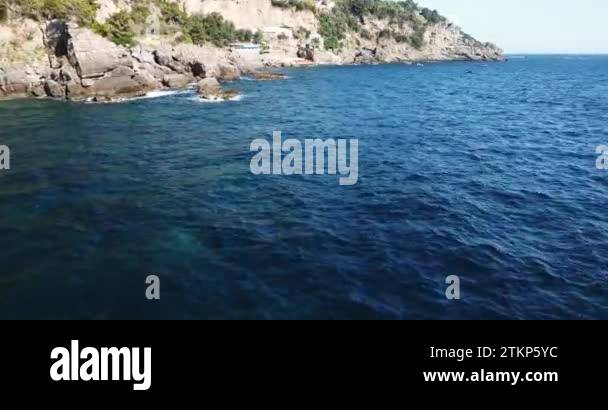 Aerial drone tracking video of luxury yacht cruising in deep blue ocean ...