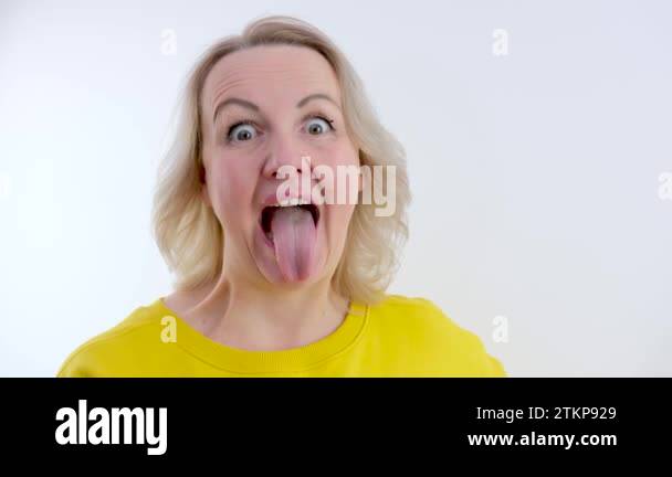 woman stuck out tongue opened eyes wide laughing teasing someone ...