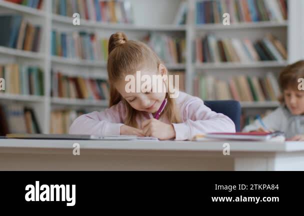 Primary education process. Close up portrait of carefree little girl ...