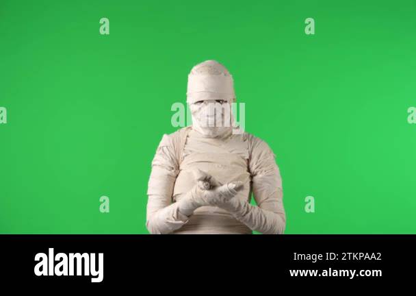 Green screen isolated chroma key video capturing a mummy clapping its ...