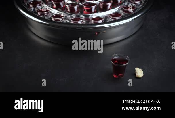 Communion glass cups on tray filled with wine the symbol of Jesus ...