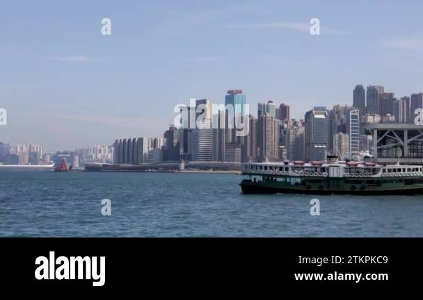 2023 Jan 9,Hong Kong.Ferry departs from Wan Chai Ferry Pier,background ...