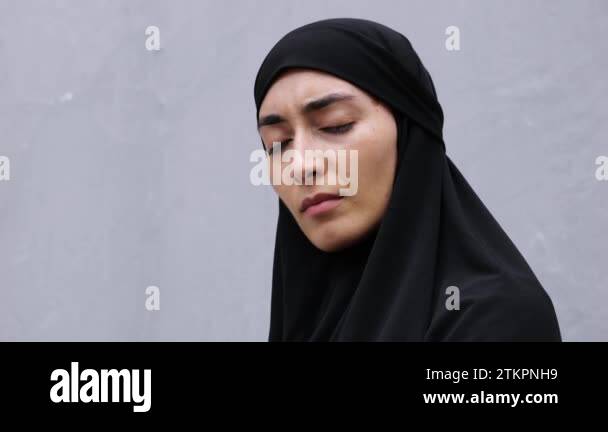 Sad face of a mirthless, depressed, strangled Muslim woman in a black ...