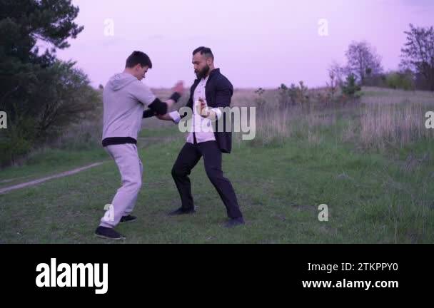 Two men fighting on the nature. 4K Stock Video Footage - Alamy