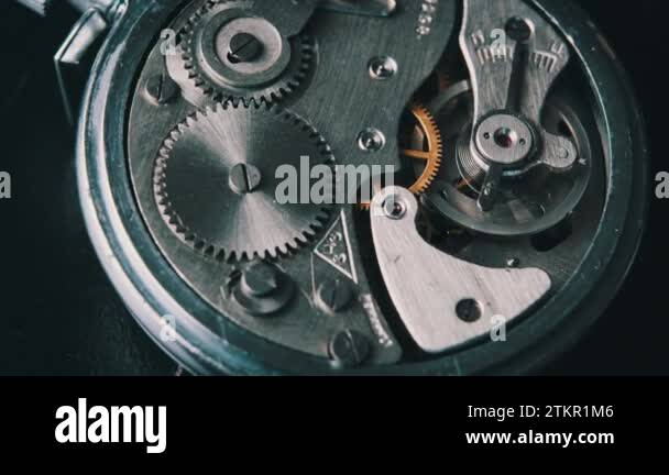 Clock mechanism rotates close-up. Vintage round stopwatch mechanism ...