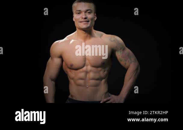 Strong bodybuilder with six pack, perfect abs, shoulders, biceps ...