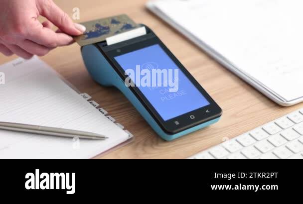 Hand places bank card on cash register and pays for purchase closeup 4k ...