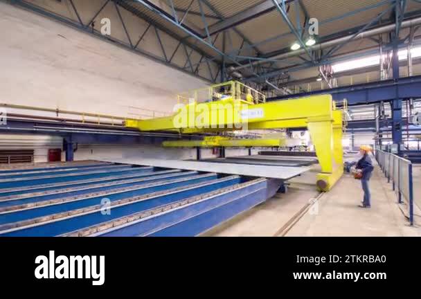 Factory workshop with yellow lifting crane device timelapse hyperlapse ...