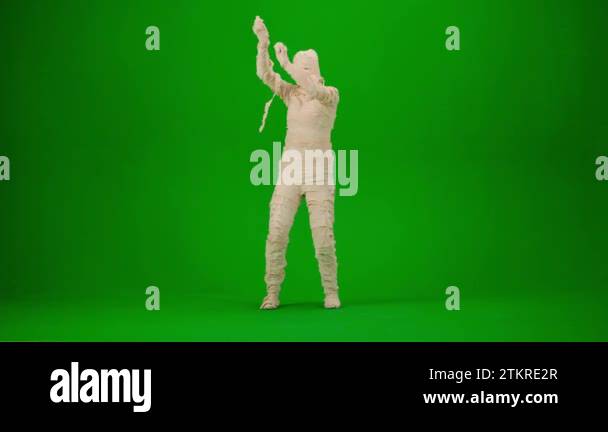 Green screen isolated chroma key video capturing a mummy dancing with ...