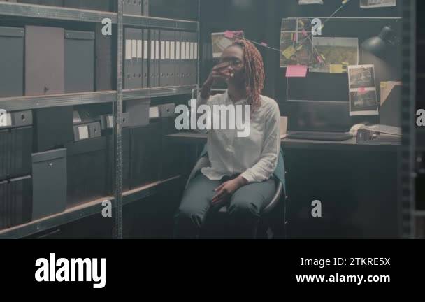 Professional detective examining evidence on hologram, working with ...