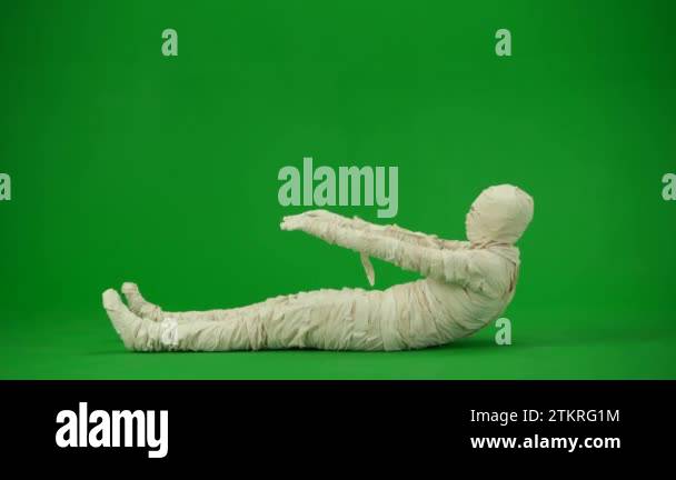 Green screen isolated chroma key video capturing a mummy rising with ...