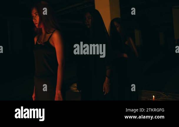 a group of satanic women perform a spirit summoning ritual in the ...