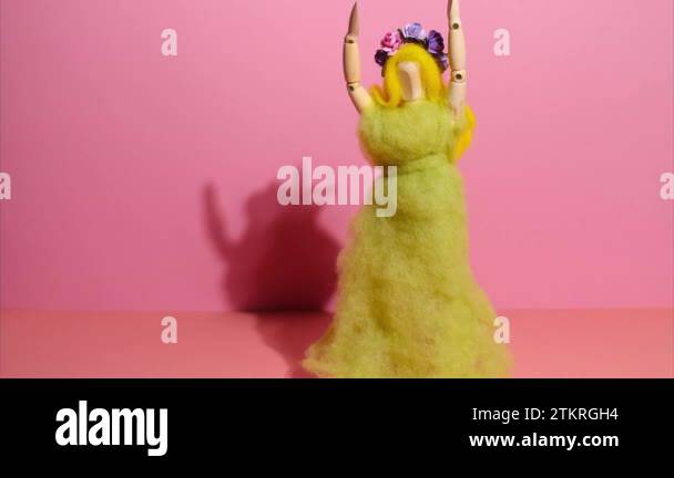 Stop motion animation, moving wooden doll made of felt. Female doll ...