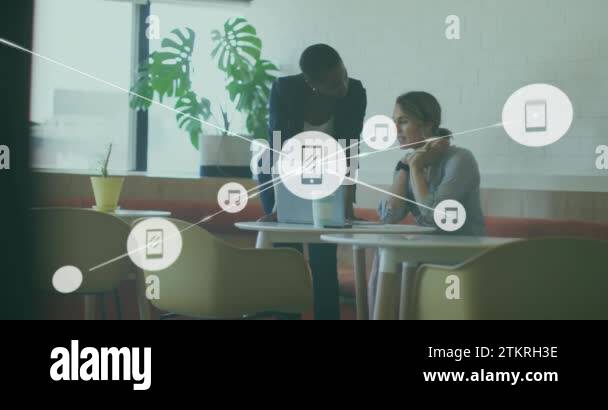 Animation of connected icons over diverse female coworkers sharing ideas in office. Digital ...