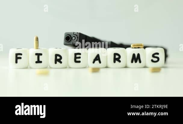 Black pistol with bullets and the word firearms. Firearms and safety ...