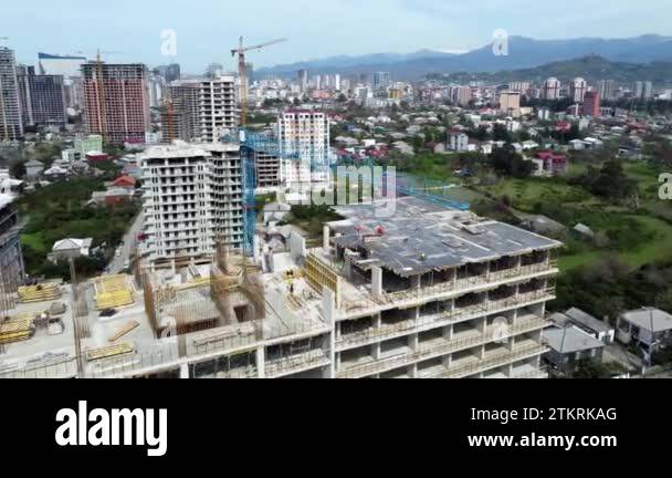 Overhead perspective of cityscape with ongoing construction of a multi ...