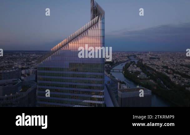 Orbit shot around modern design high rise building with glossy glass ...