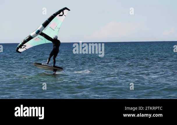 Modern water sport. Hydrofoil ride on the ocean using the wing and the ...