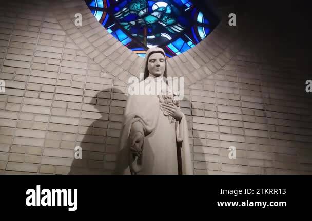 The Statue of the Virgin Mary, Standing Indoors with Her Head Down ...