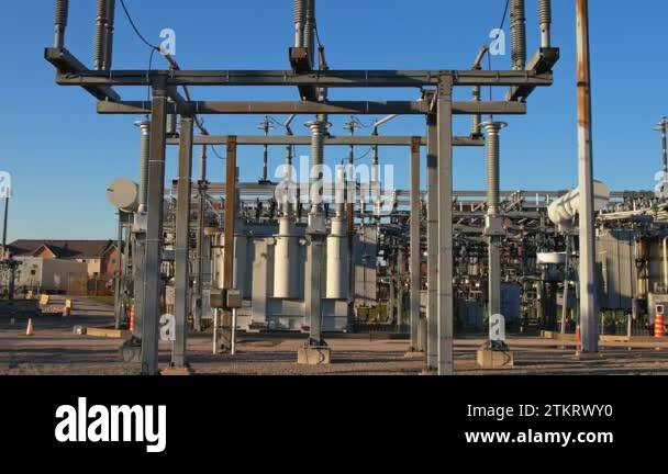 High voltage substation with pylons and distribution cables ...