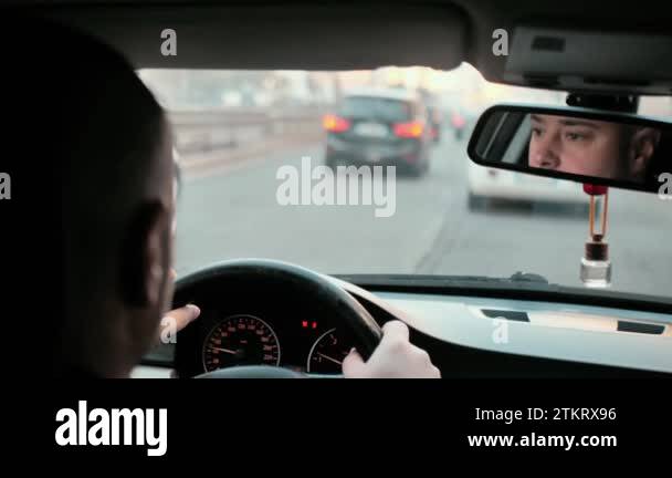 Road trip, car traveling concept. Car driver, rear view. A man drives ...