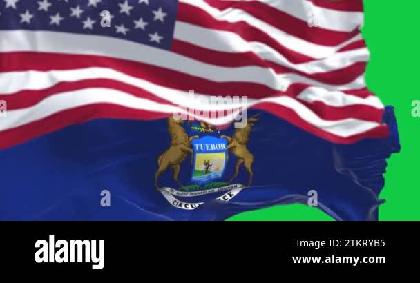 Flags of Michigan and the United States waving in the wind isolated ...