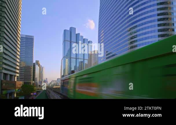 BTS Skytrain, light metro electric train, running fast in downtown ...