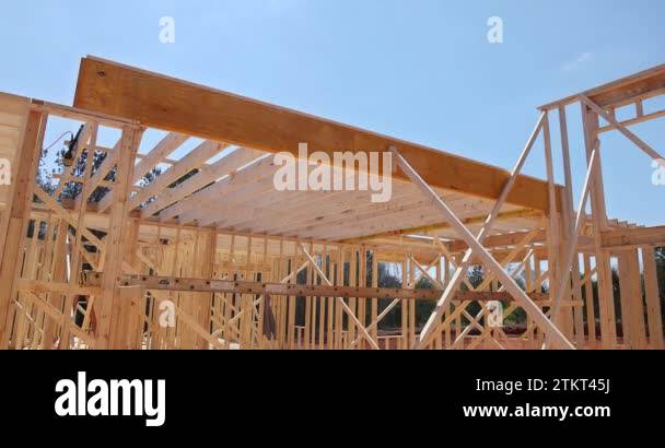 Support beams beams roof construction at new house construction using ...