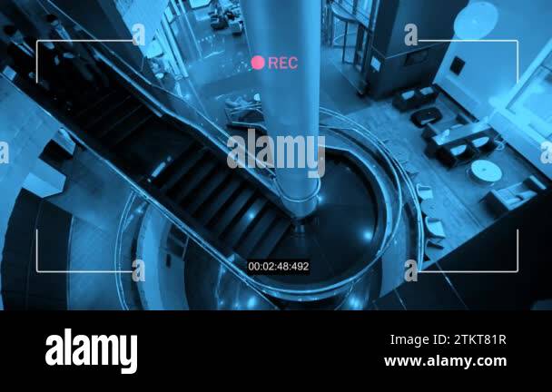 High angle security camera footage of two businessmen walking down ...