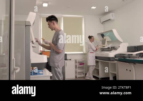 Researchers working in a lab. Scientists using modern laboratory ...