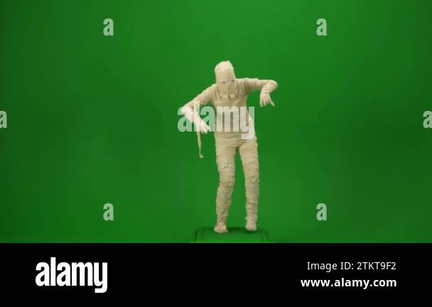 Green screen isolated chroma key video capturing a mummy staggering ...