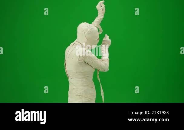 Green screen isolated chroma key video capturing a mummy dancing with ...
