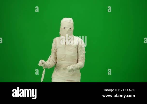 Green screen isolated chroma key video capturing a mummy walking ...