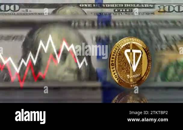 Toncoin TON cryptocurrency golden coin over 100 Dollar banknotes. US ...