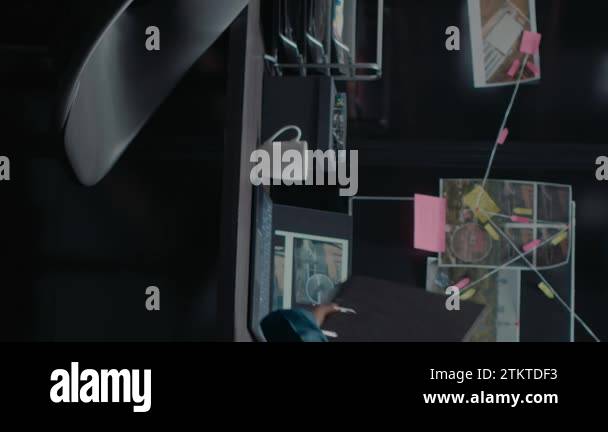 Vertical video: Police investigator examining clues from crime scene ...