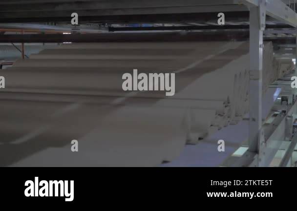 Corrugated cardboard pulp on a paper mill conveyor belt. Industrial ...