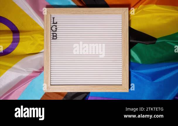 Stop motion LGBTQ description frame on Rainbow LGBTQIA flag made from ...